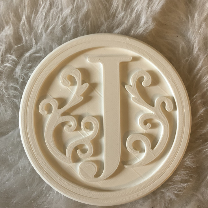 3D Printable Coaster letter 'J' by raimonvibe