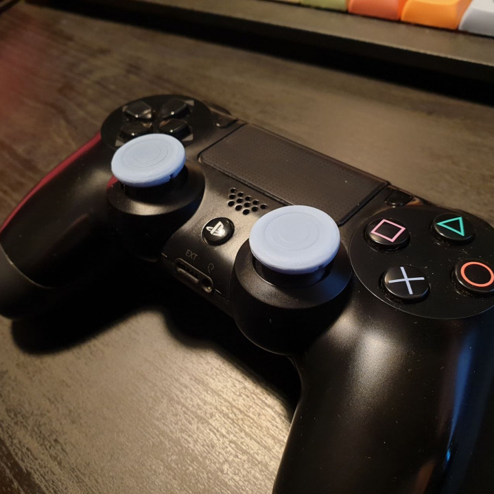 3D Printable Dualshock 4 Thumbstick Cover by Tane Lattanzio