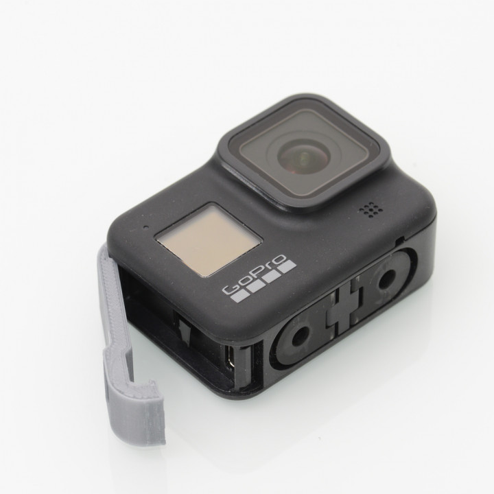 3D Printable Gopro hero 8 charging door by Franck