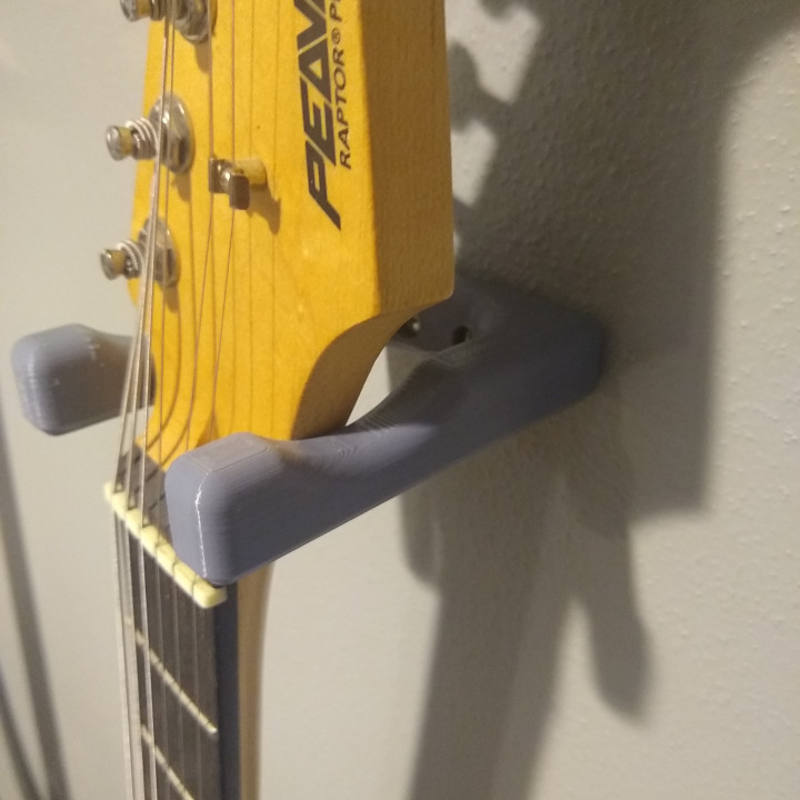 3D Printable Guitar Wall Mount Holder by Devan Metz