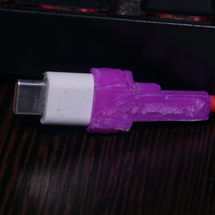 3D Printable USB stress relief cable retainer by Miras Derbissalin