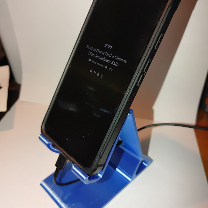 3D Printable Phone Stand w/ Charging Port by Roger W. Boyer Jr.
