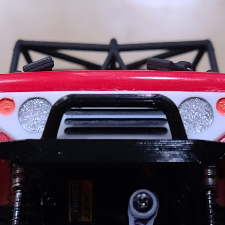3D Printable SCX24 Bumper for TGH-24X Chassis by Derrick B. Williams