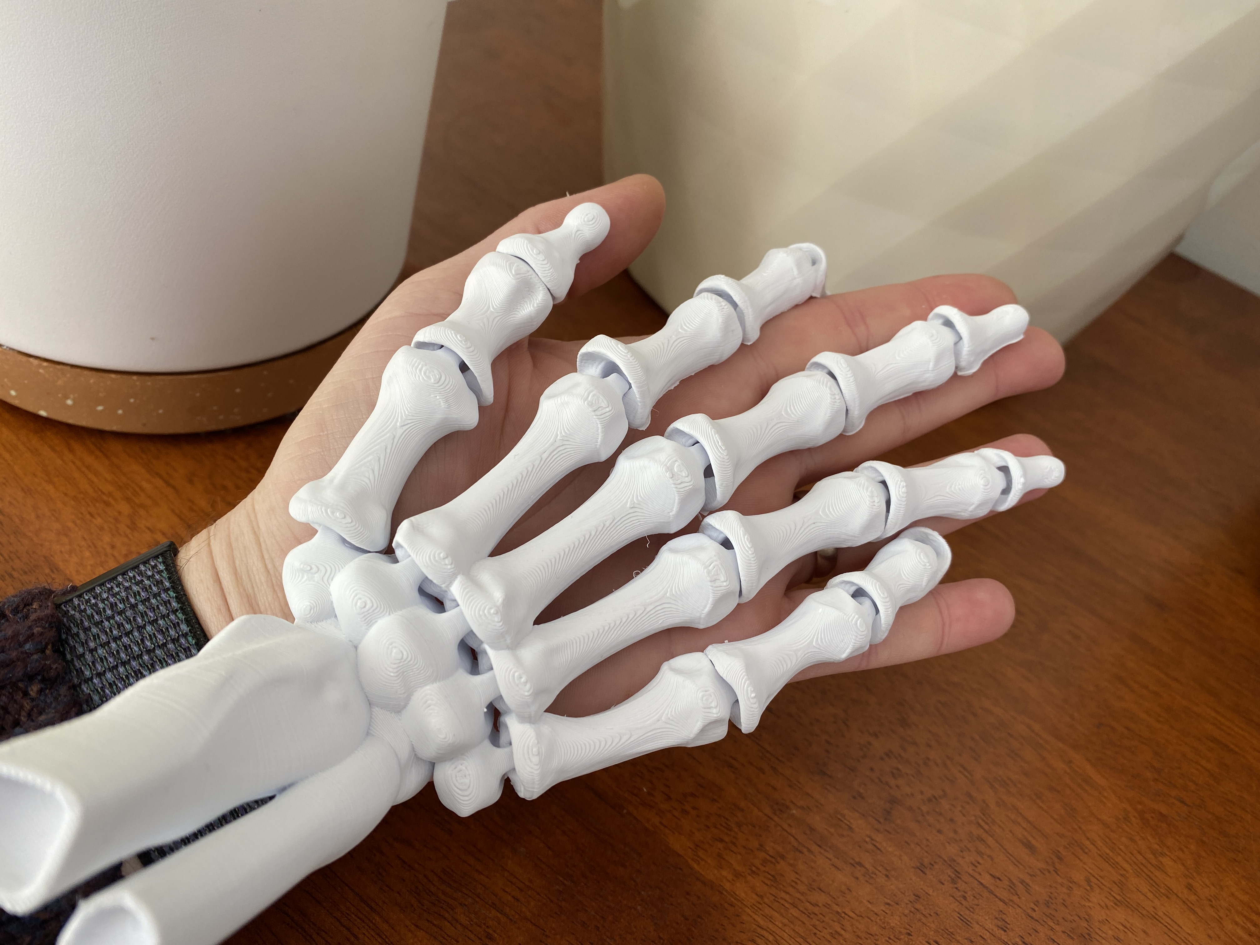 3D Printable FLEXI PRINT-IN-PLACE SKELETON HAND by Flexi Factory
