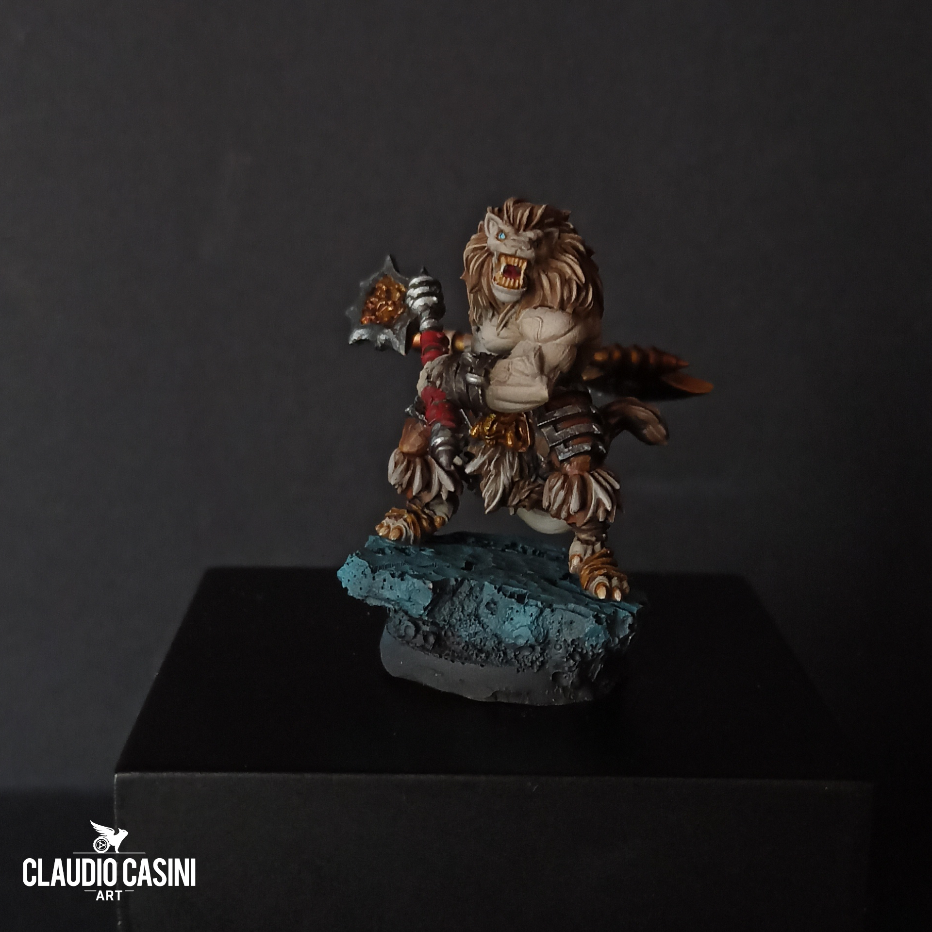 3D Printable (0092) Male felinid lionfolk barbarian with two axes by Claudio Casini Art