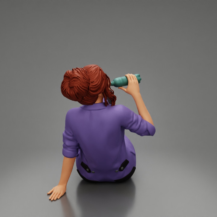 3D Printable Tired woman mechanic sitting and drinking water during ...
