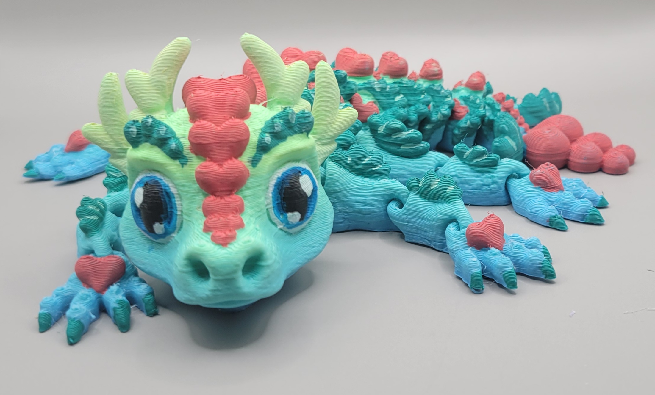 3D Printable Love-ly Tiny Dragon, Articulated, Flexy, Toy by NOZZLE NOOK
