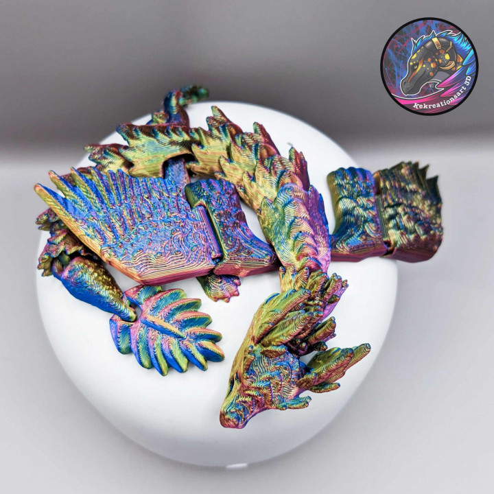 3D Printable Flexi Baby Feather Dragon Keychain by Kirsten M