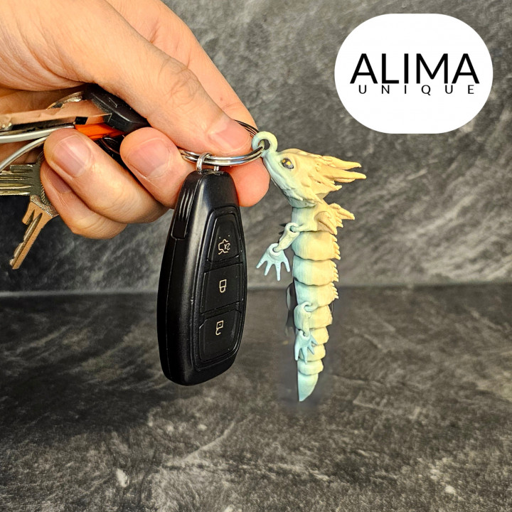 3D Printable Keychain - Flexi little baby dragon by ALIMA UNIQUE DESIGNS