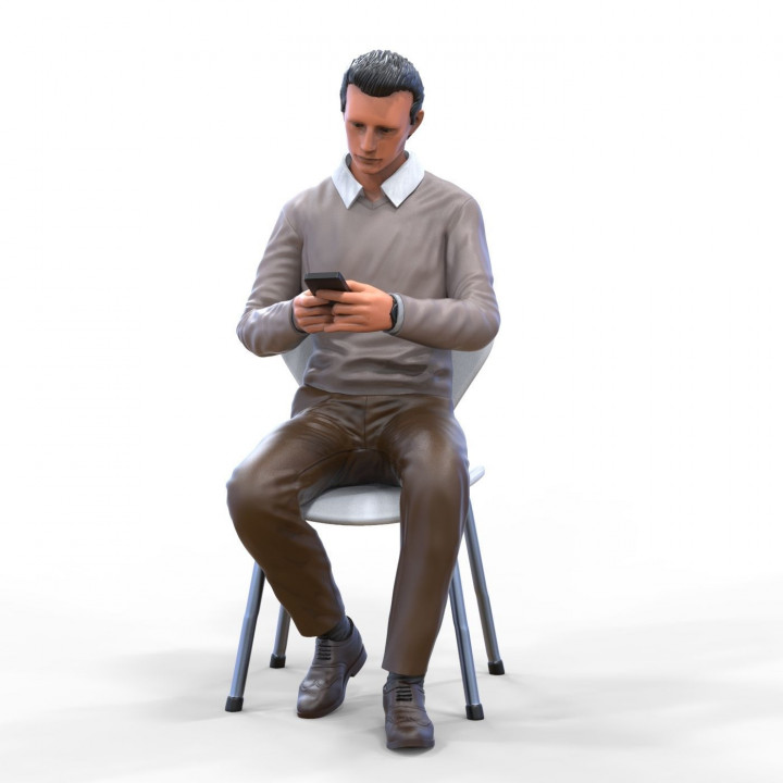 3D Printable A Man sitting on a chair with smartphone by 3DP Miniatures