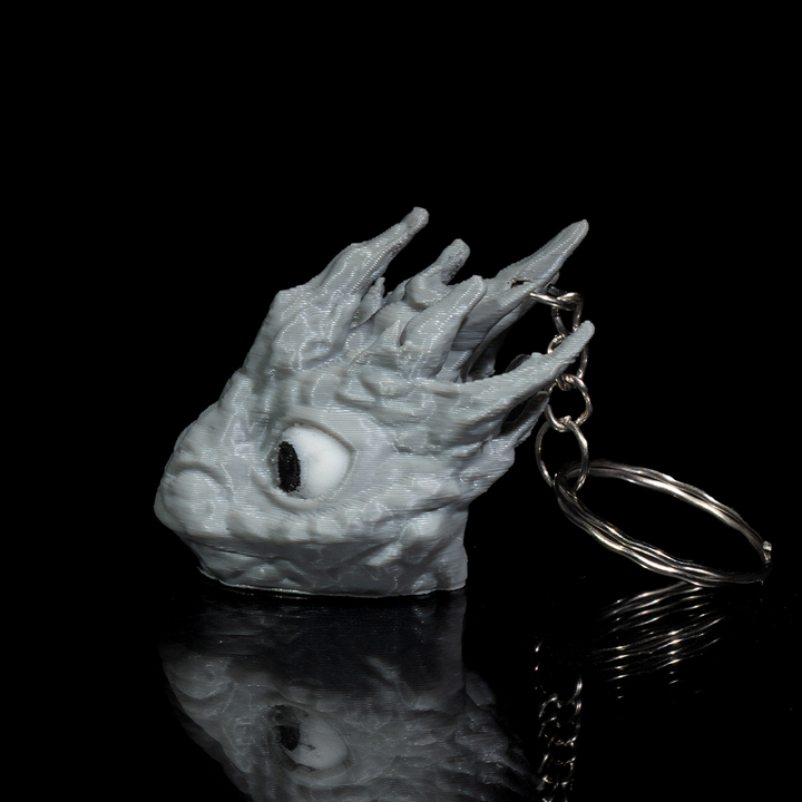 3D Printable Pebble Dragon Keychain by Stlflix