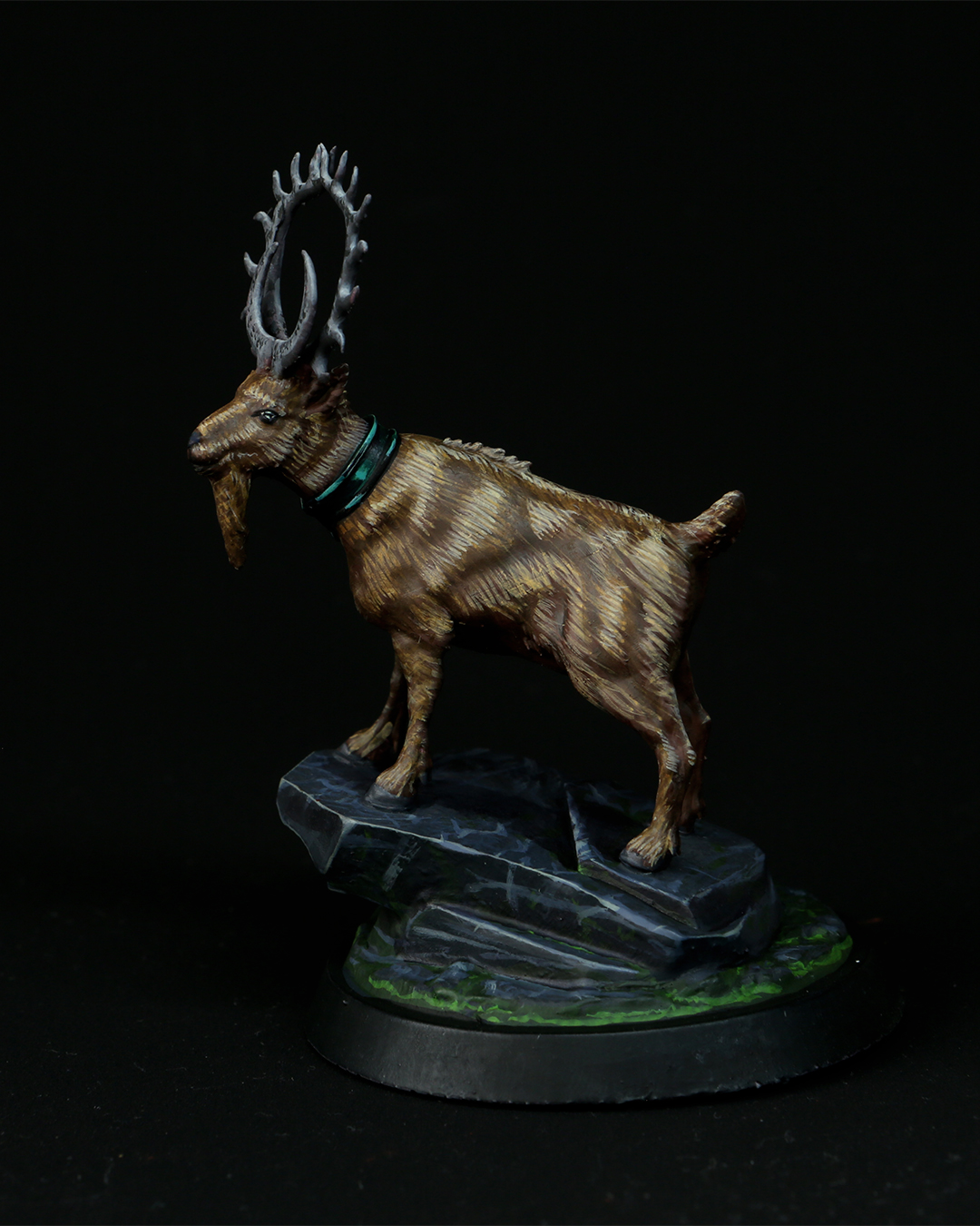 3D Printable Fantasy goat with sun and moon horns standing on rock ...