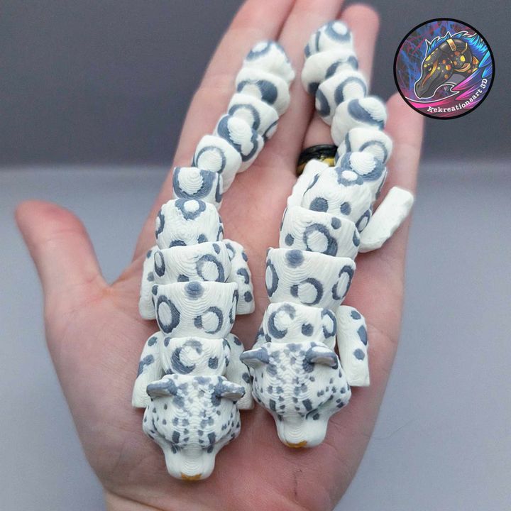 3D Printable Baby Flexi Snow Leopard Keychain by Kirsten M