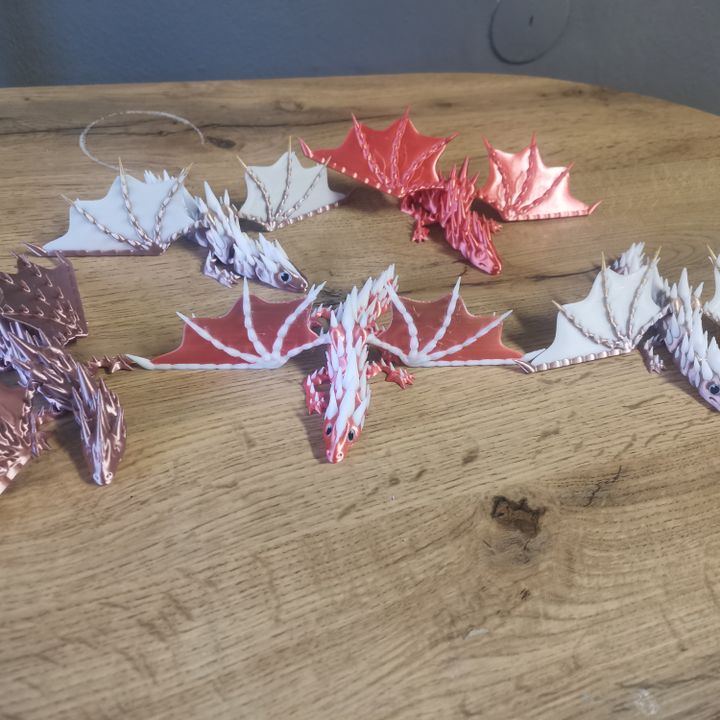 3D Printable Cute multicolor spikey dragon by BT3D&DeusCat