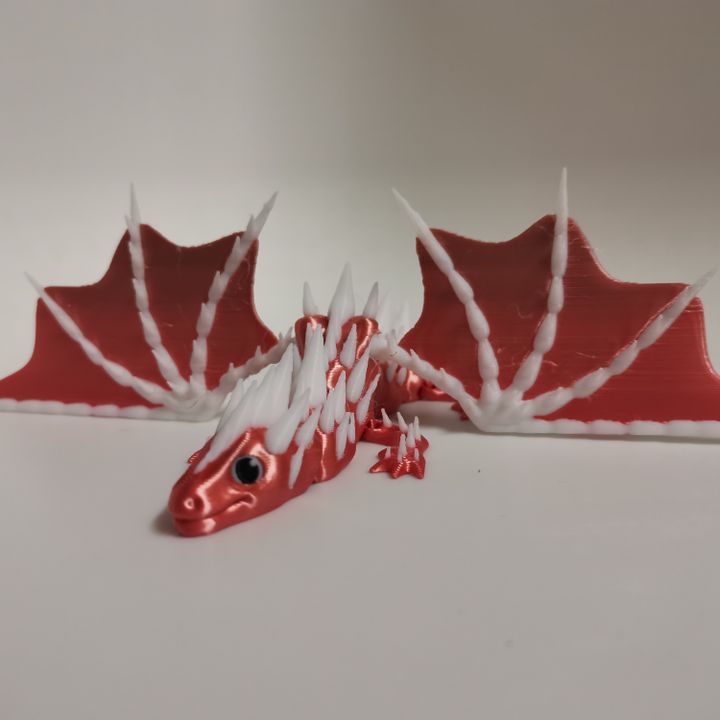 3D Printable Cute multicolor spikey dragon by BT3D&DeusCat
