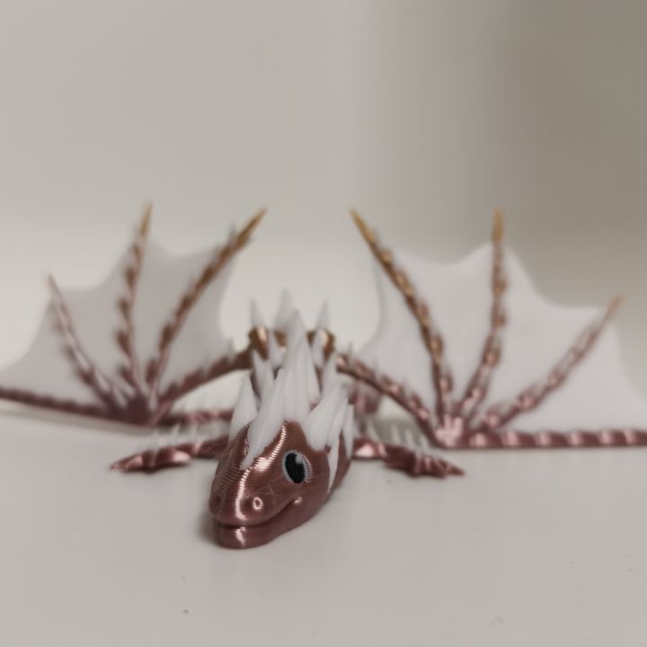 3D Printable Cute multicolor spikey dragon by BT3D&DeusCat