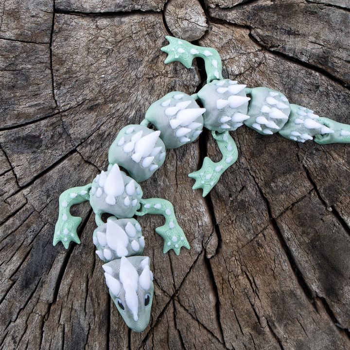 3D Printable Cute multicolor articulated spikey dragon lizard by BT3D ...
