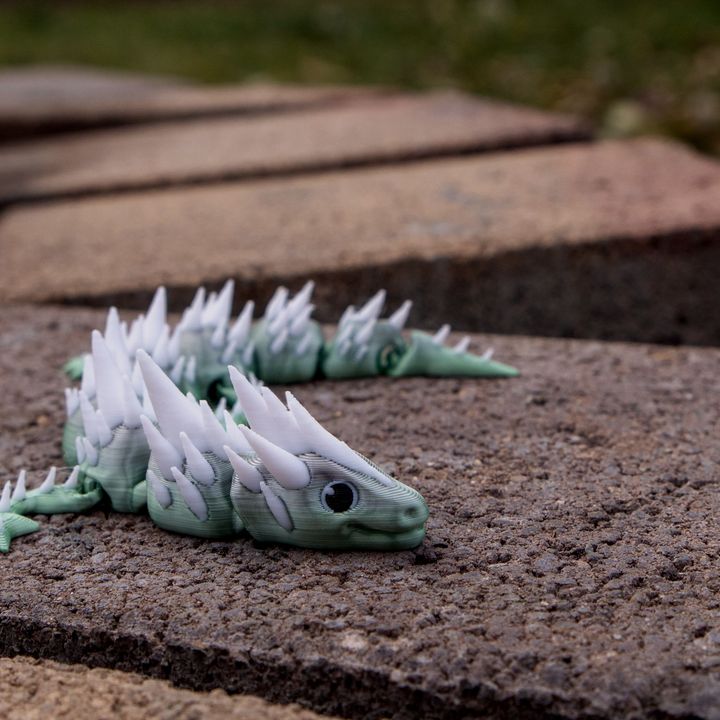 3D Printable Cute multicolor articulated spikey dragon lizard by BT3D ...
