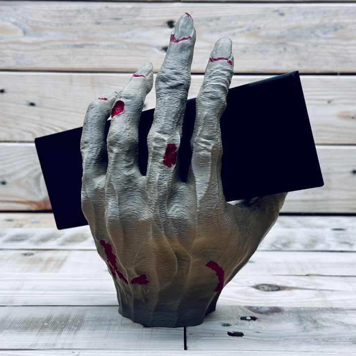 3D Printable Freestanding Zombies hand with Help sign by ENIQUE3D