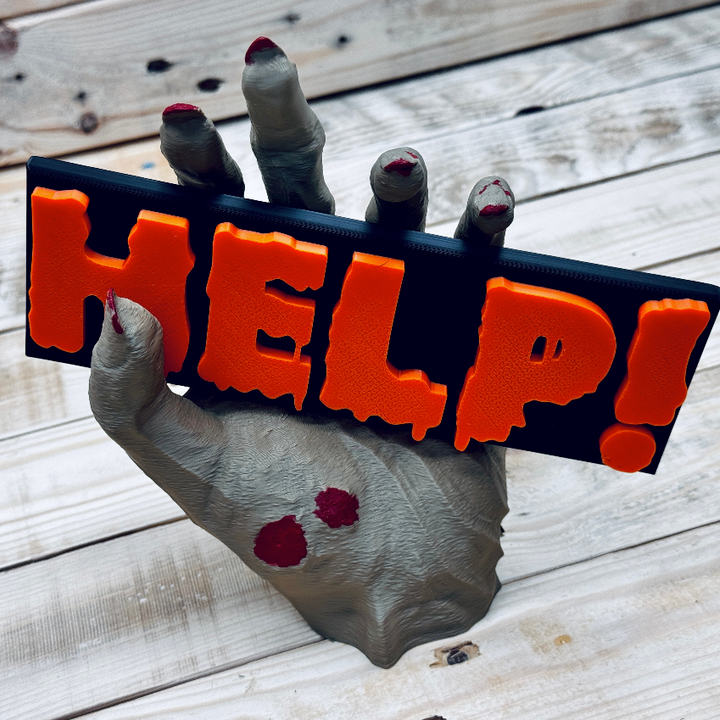 3D Printable Freestanding Zombies hand with Help sign by ENIQUE3D