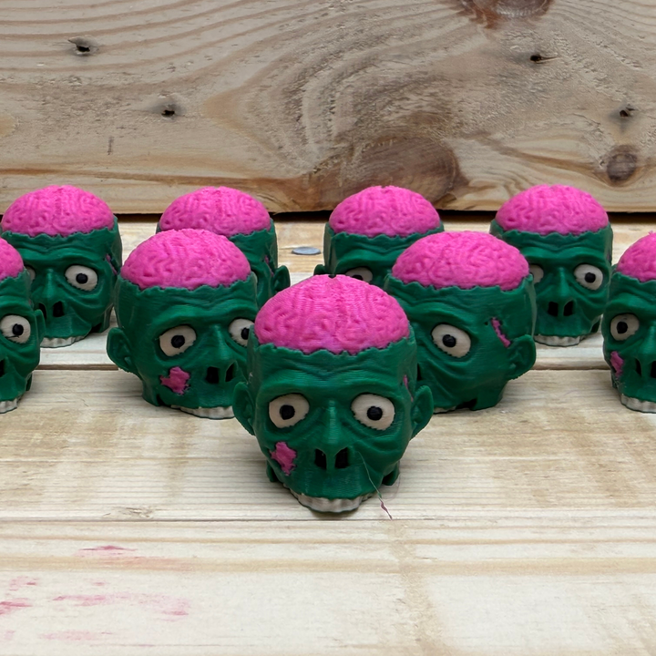 3D Printable Mini Zombie Heads by ENIQUE3D