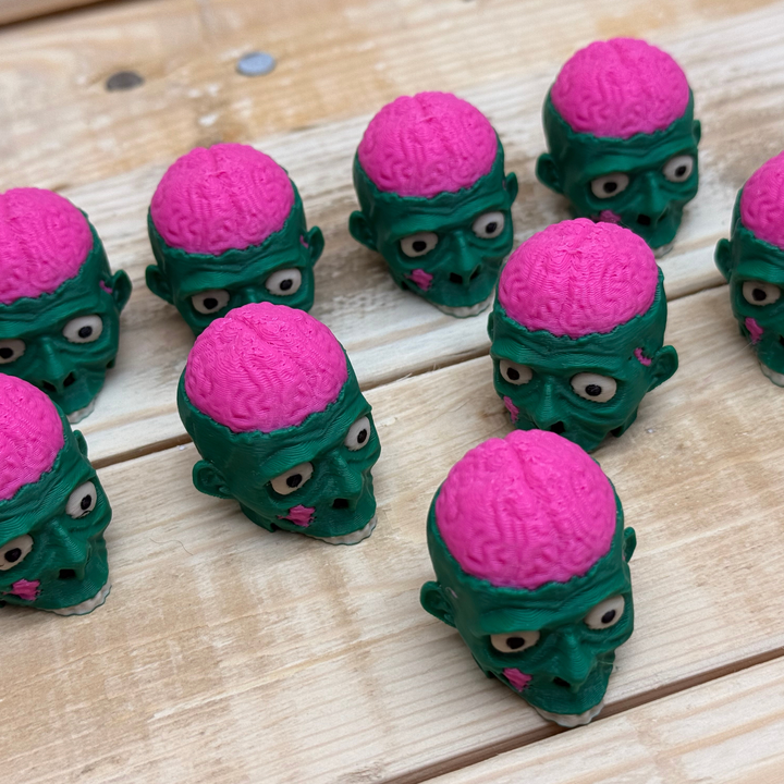 3D Printable Mini Zombie Heads by ENIQUE3D