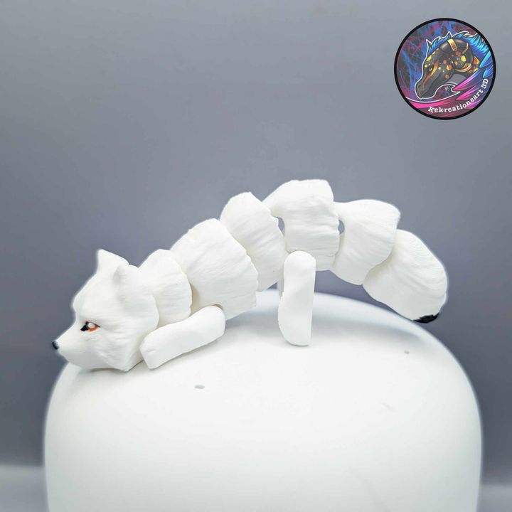 3D Printable Baby Flexi Arctic Fox Keychain by Kirsten M