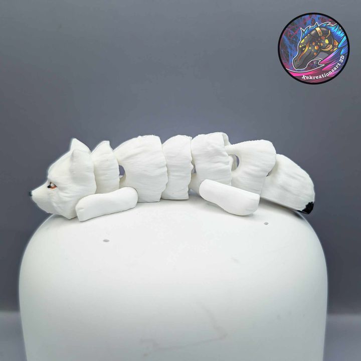 3D Printable Baby Flexi Arctic Fox Keychain by Kirsten M