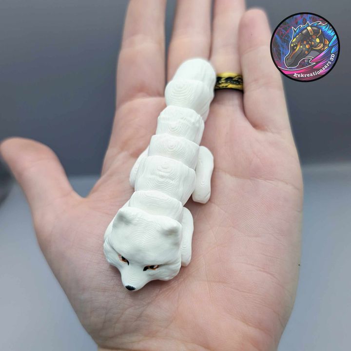 3D Printable Baby Flexi Arctic Fox Keychain by Kirsten M