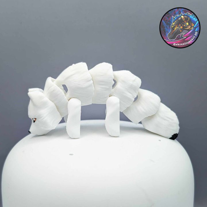 3D Printable Baby Flexi Arctic Fox Keychain by Kirsten M