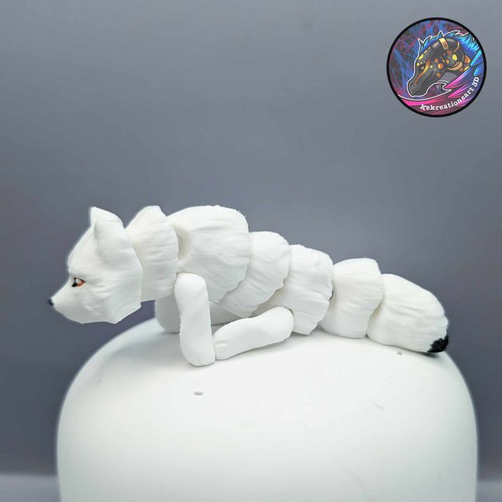 3D Printable Baby Flexi Arctic Fox Keychain by Kirsten M