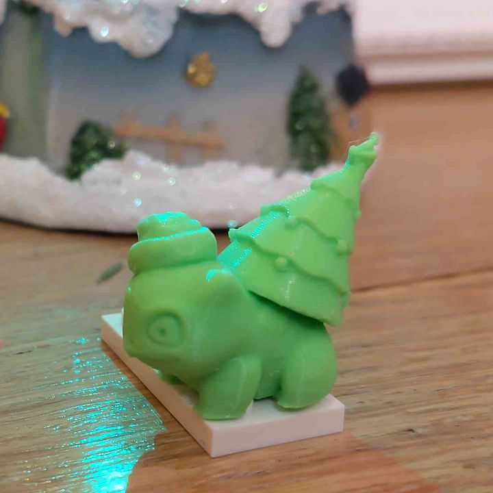 3D Printable Christmas bulbasaur with tree and hat ornament on 4 lego ...