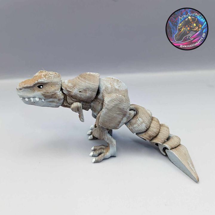 3D Printable Baby Flexi T Rex Keychain by Kirsten M