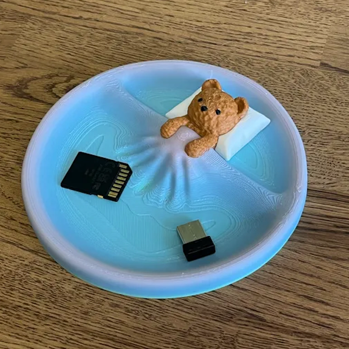 3D Printable Sleeping teddy bear plate by Myron
