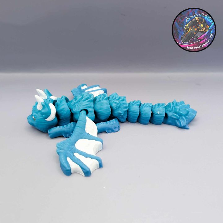 3D Printable Baby Flexi Cat Dragon Keychain by Kirsten M