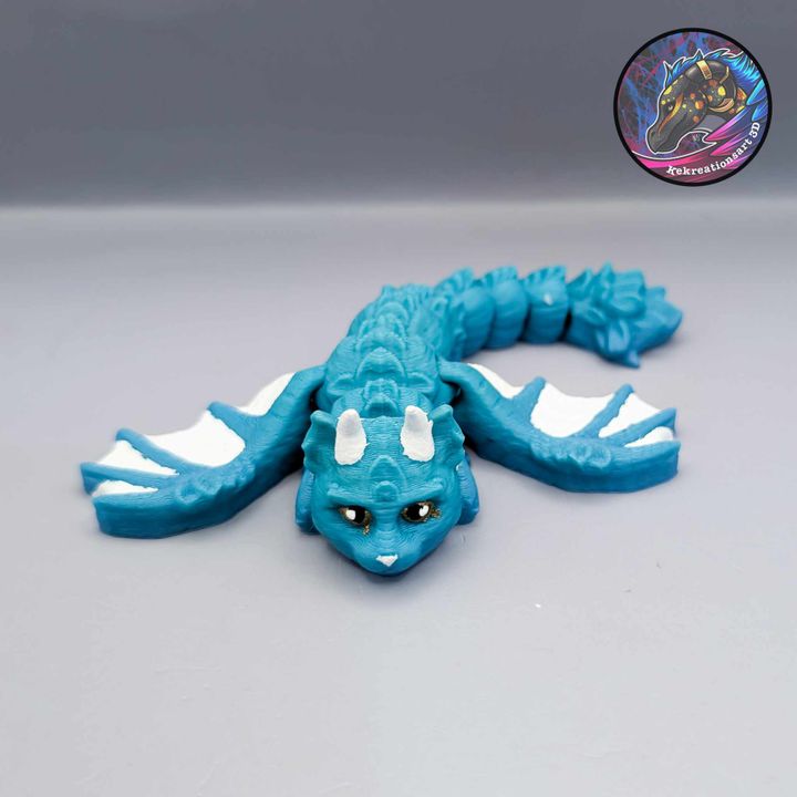3D Printable Baby Flexi Cat Dragon Keychain by Kirsten M