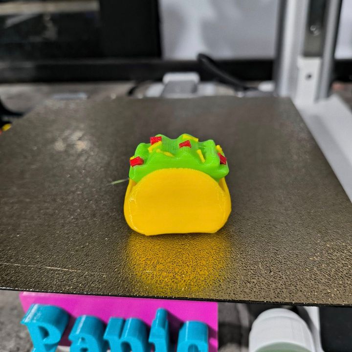 3D Printable Happy Taco Clicky Fidget and Keychain by Tiffany Drewry