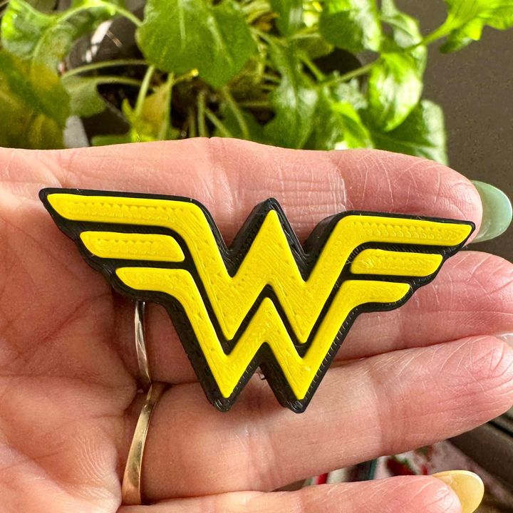 3D Printable Wonder Woman Clicker Fidget and Keychain by Jambaby Designs