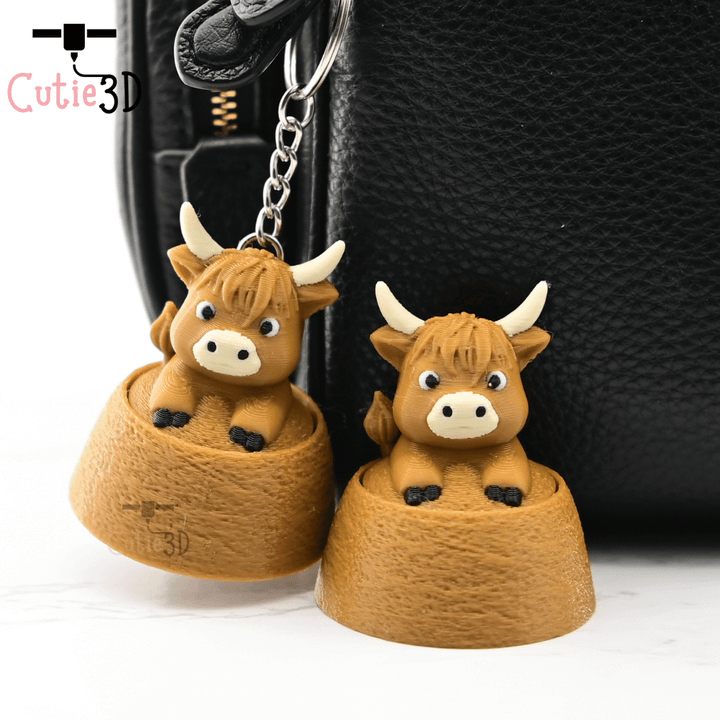 3D Printable Cutie3D Highland Cow On Hay Keycap Fidget Clicker Keychain ...